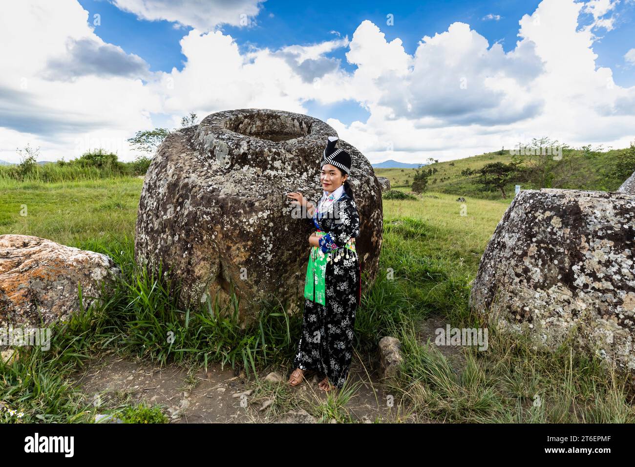Plain of Jars(Jars plain), Megalithic jar and local costumed woman ...