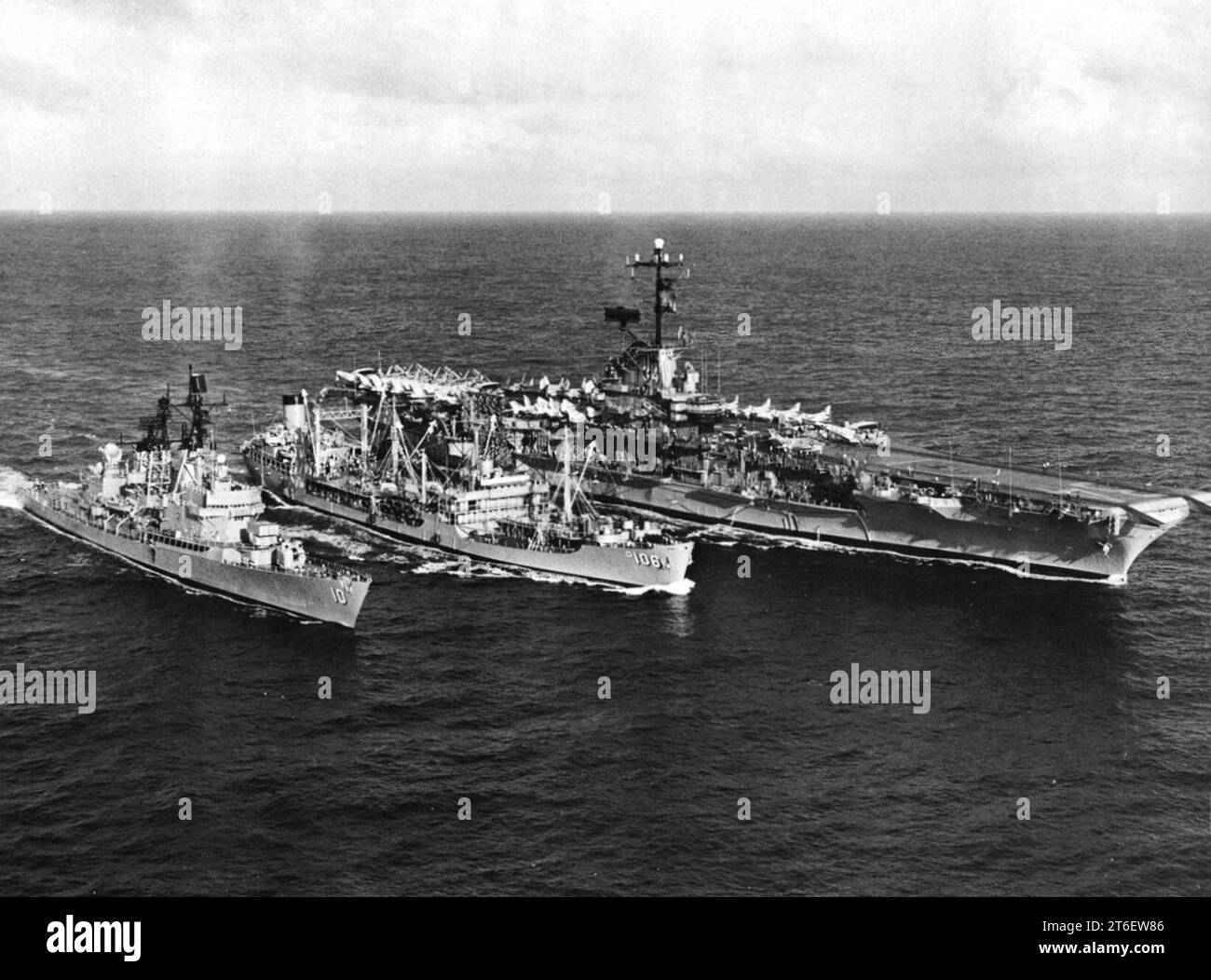 USS Navasota (AO-106) refuels USS Oriskany (CVA-34) and USS King (DLG ...