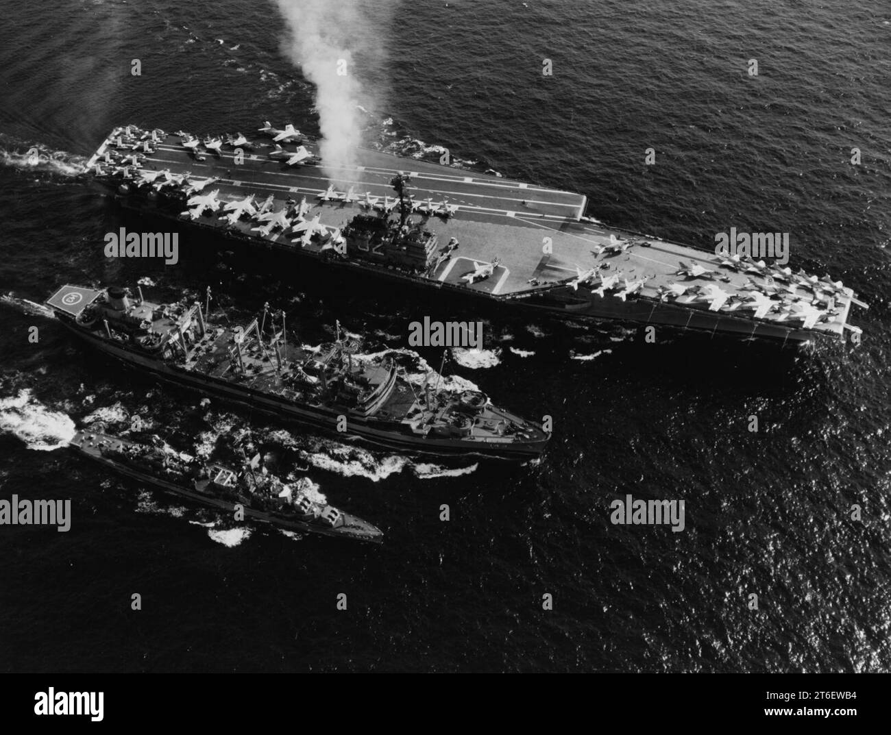 USS Neosho (AO-143) refuels USS Independence (CVA-62) and USS Dyess ...