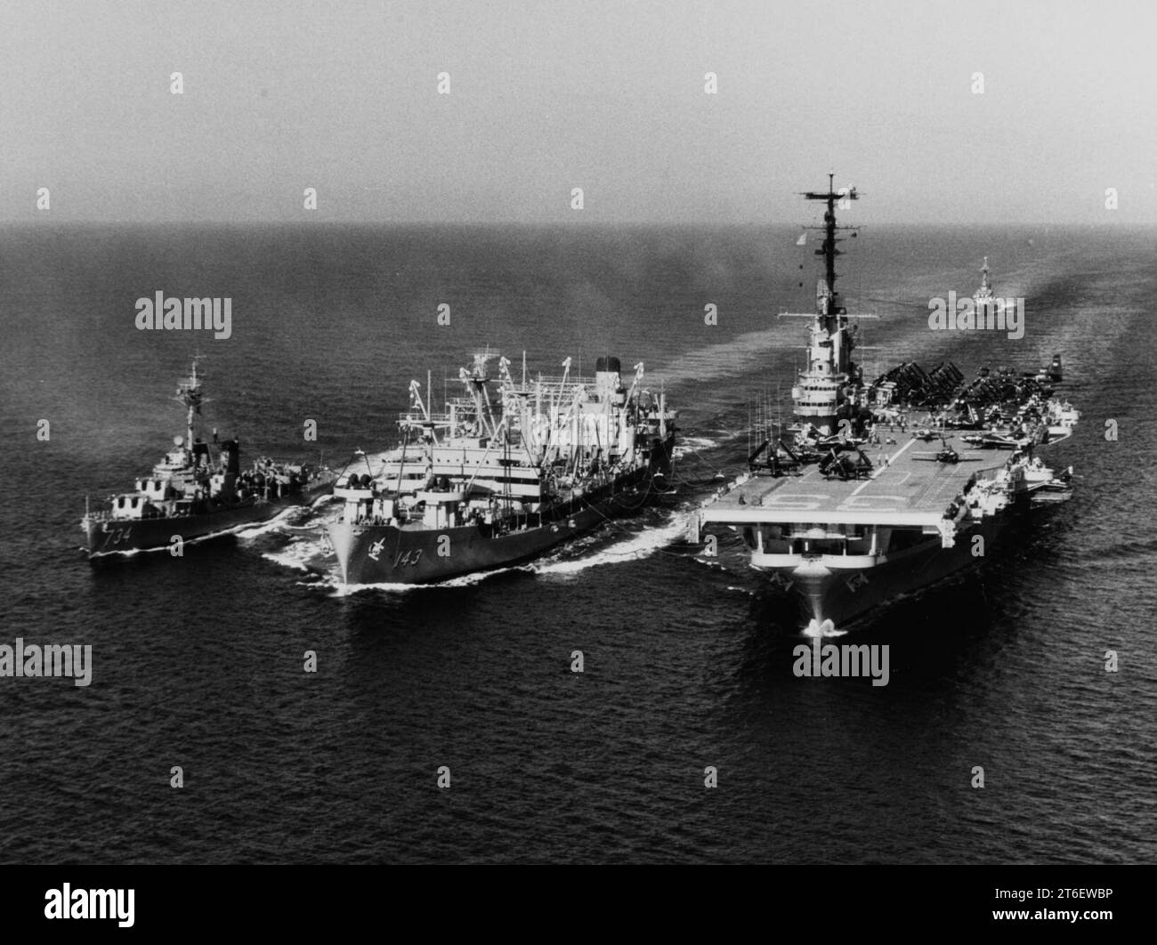 USS Neosho (AO-143) refuels USS Lake Champlain (CVA-39) and USS Purdy ...