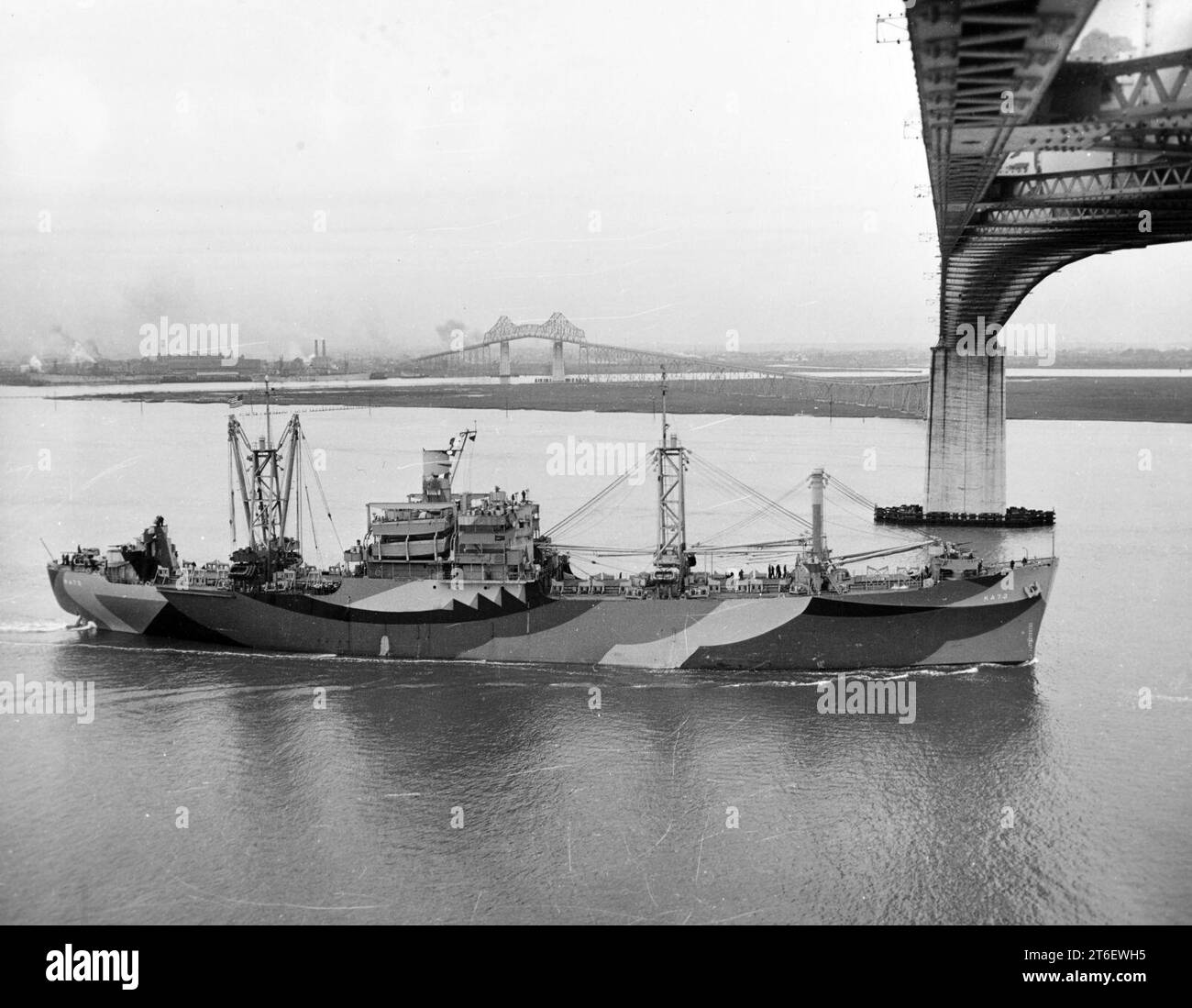 USS New Hanover (AKA-73) passing under the Cooper River Bridge at ...