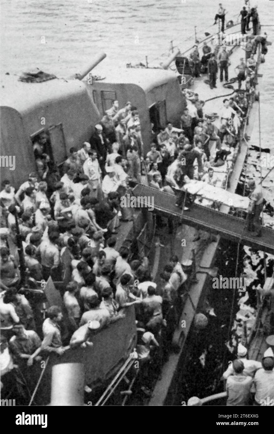 USS Nicholas (DD-449) transfers surviors from the sunken USS Helena (CL ...