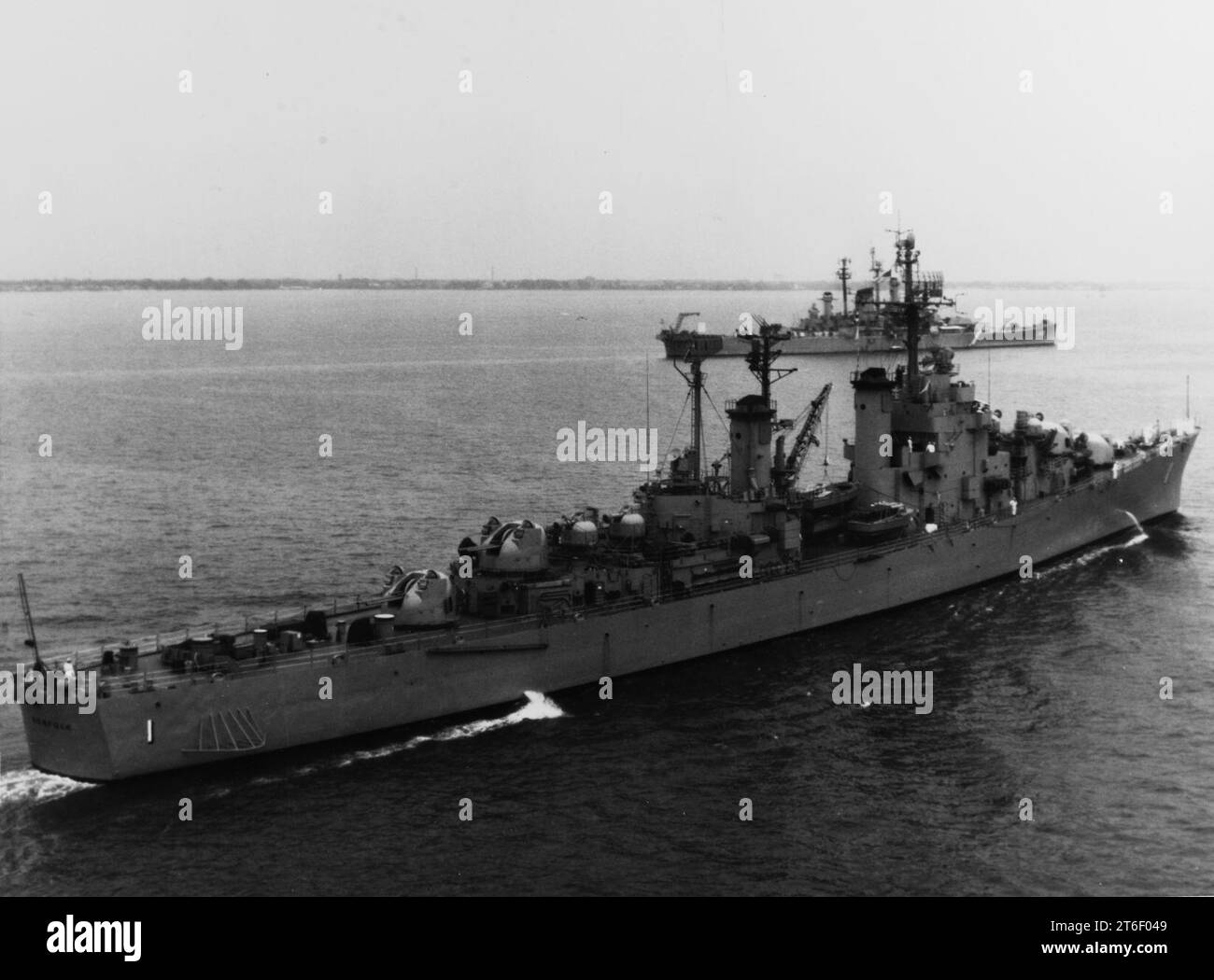 USS Norfolk (DL-1) and USS Newport News (CA-148) underway in the mid ...