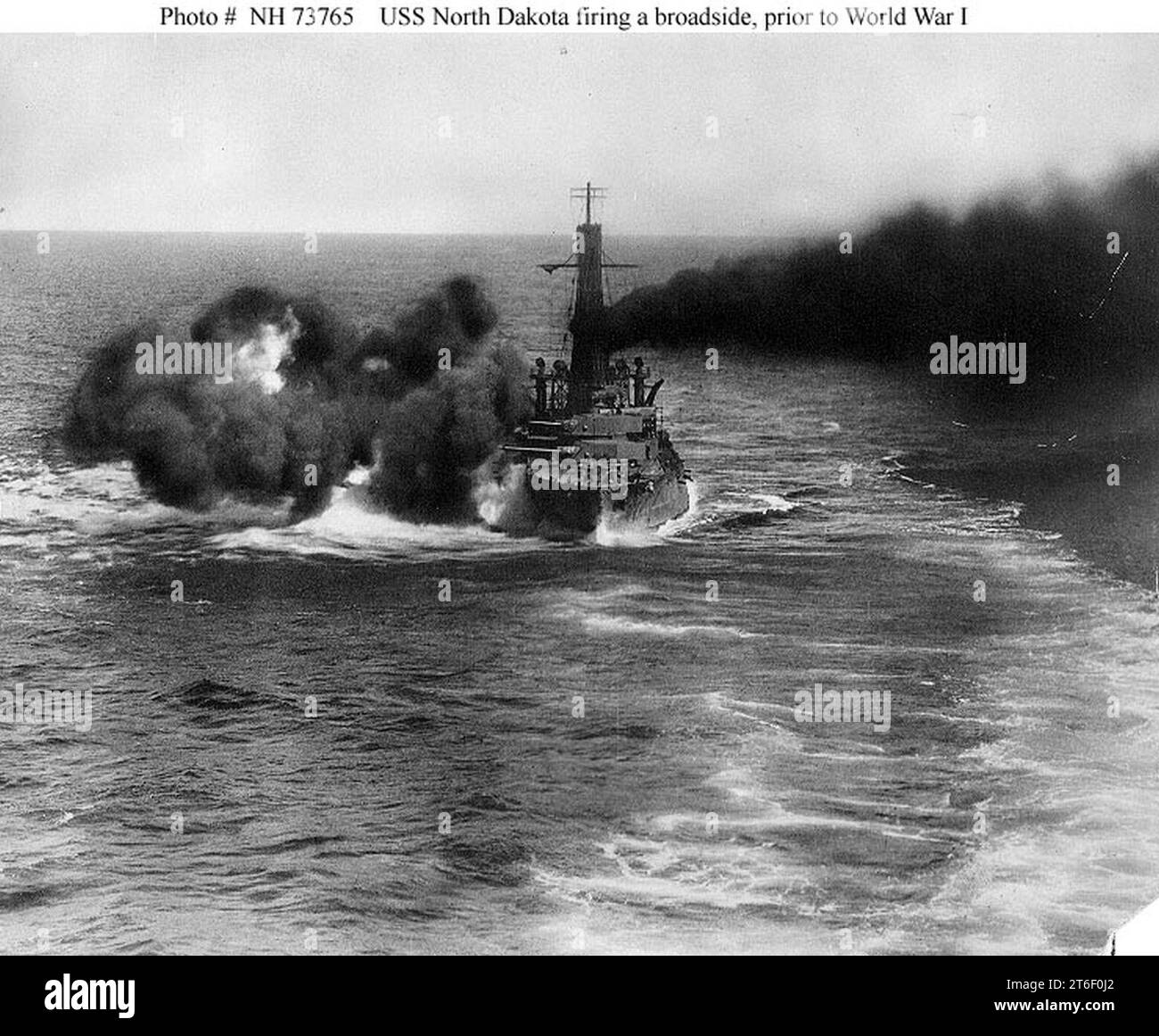 USS North Dakota firing a broadside Stock Photo - Alamy