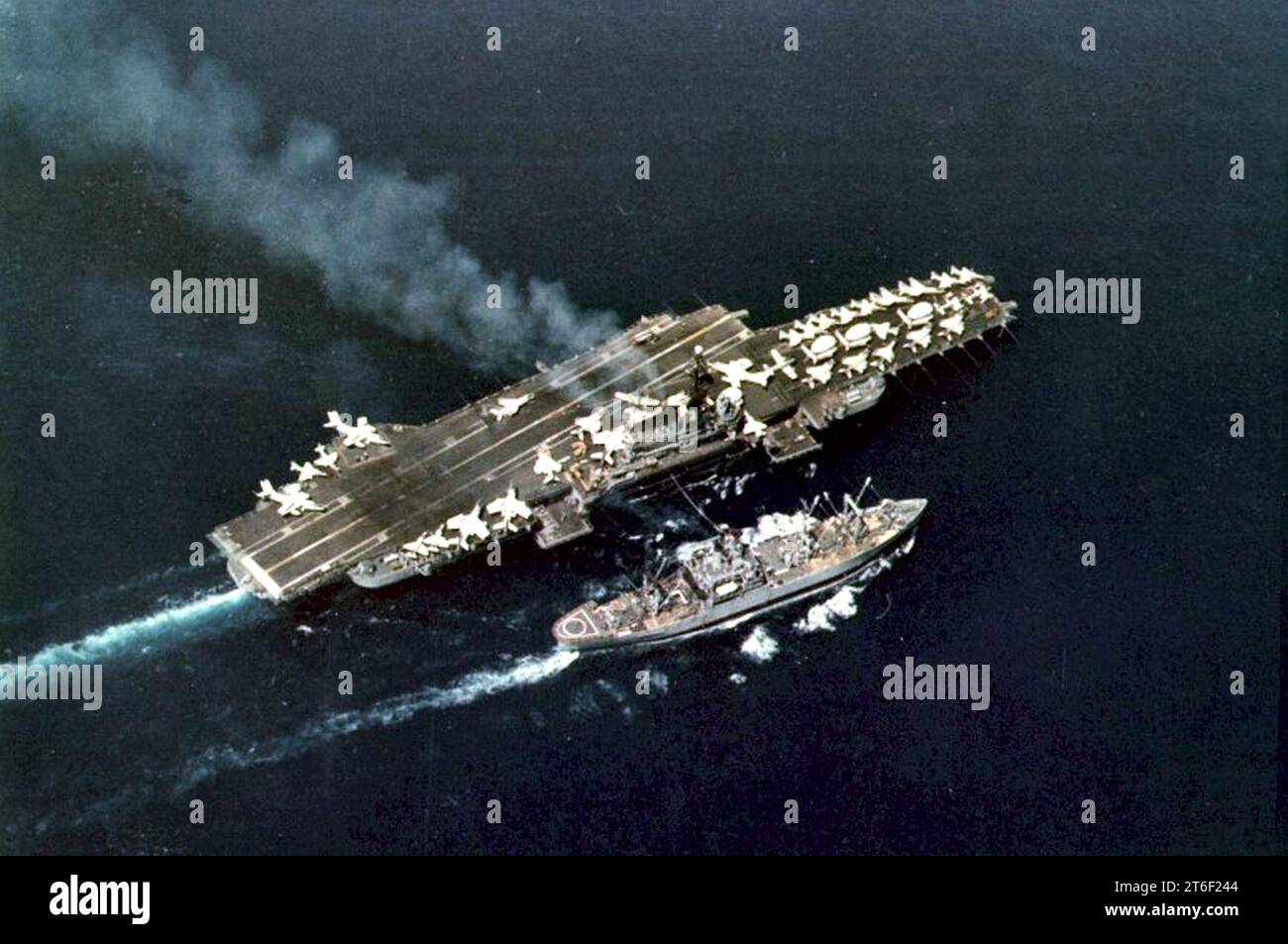 USS Paricutin (AE-18) replenishing USS Coral Sea (CVA-43) in 1965 Stock ...