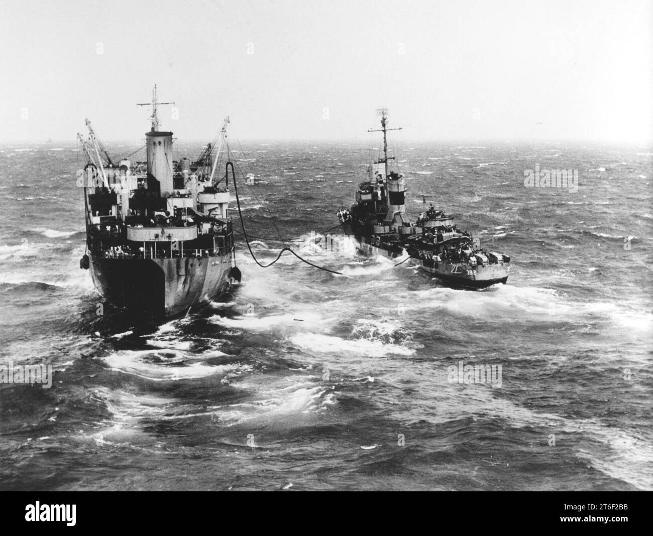 USS Patterson (DD-392) refueling from an oiler on 12 January 1945 Stock ...
