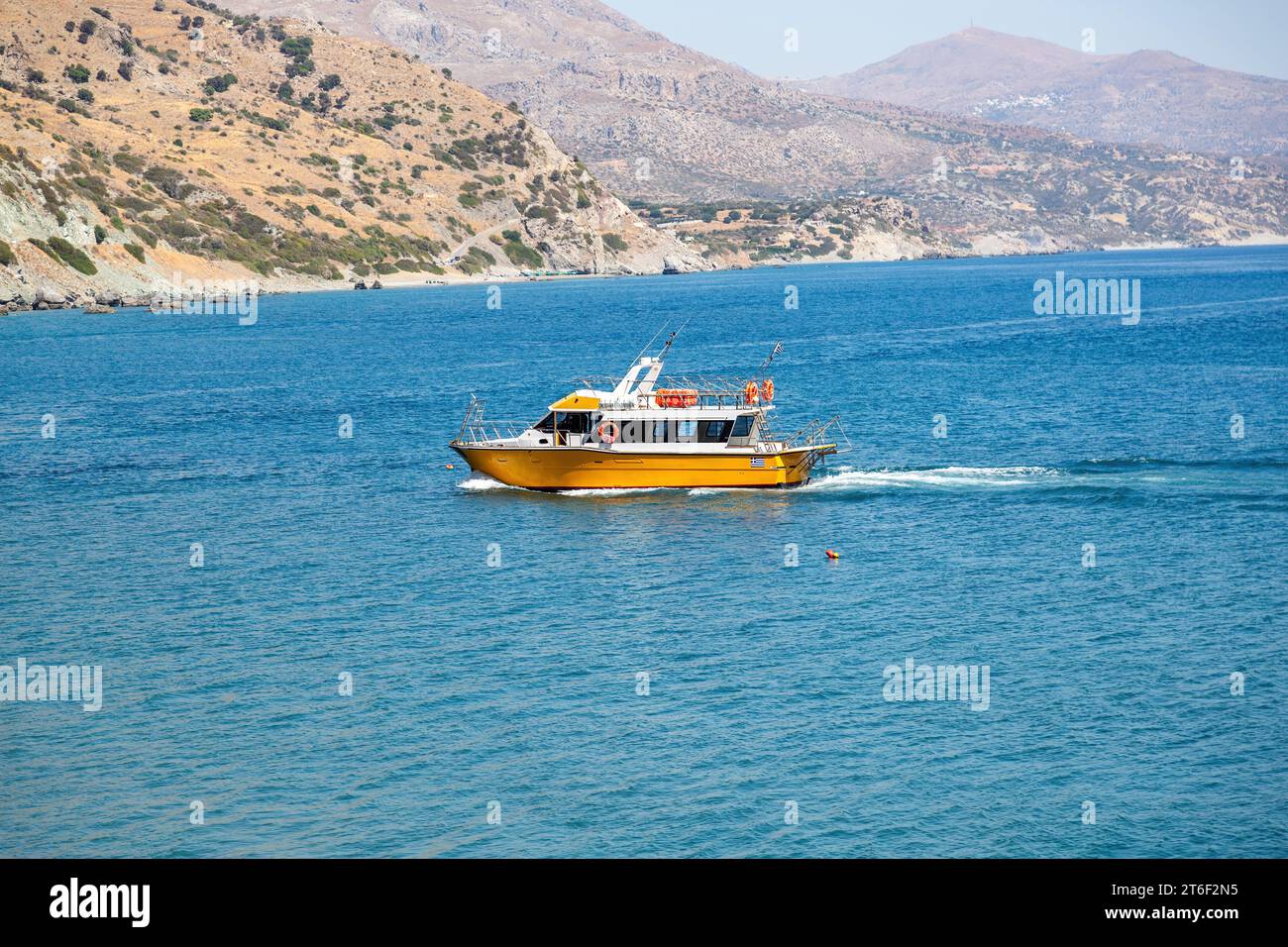 Greece island summer destination. Yellow cruise boat in ripple Aegean ...