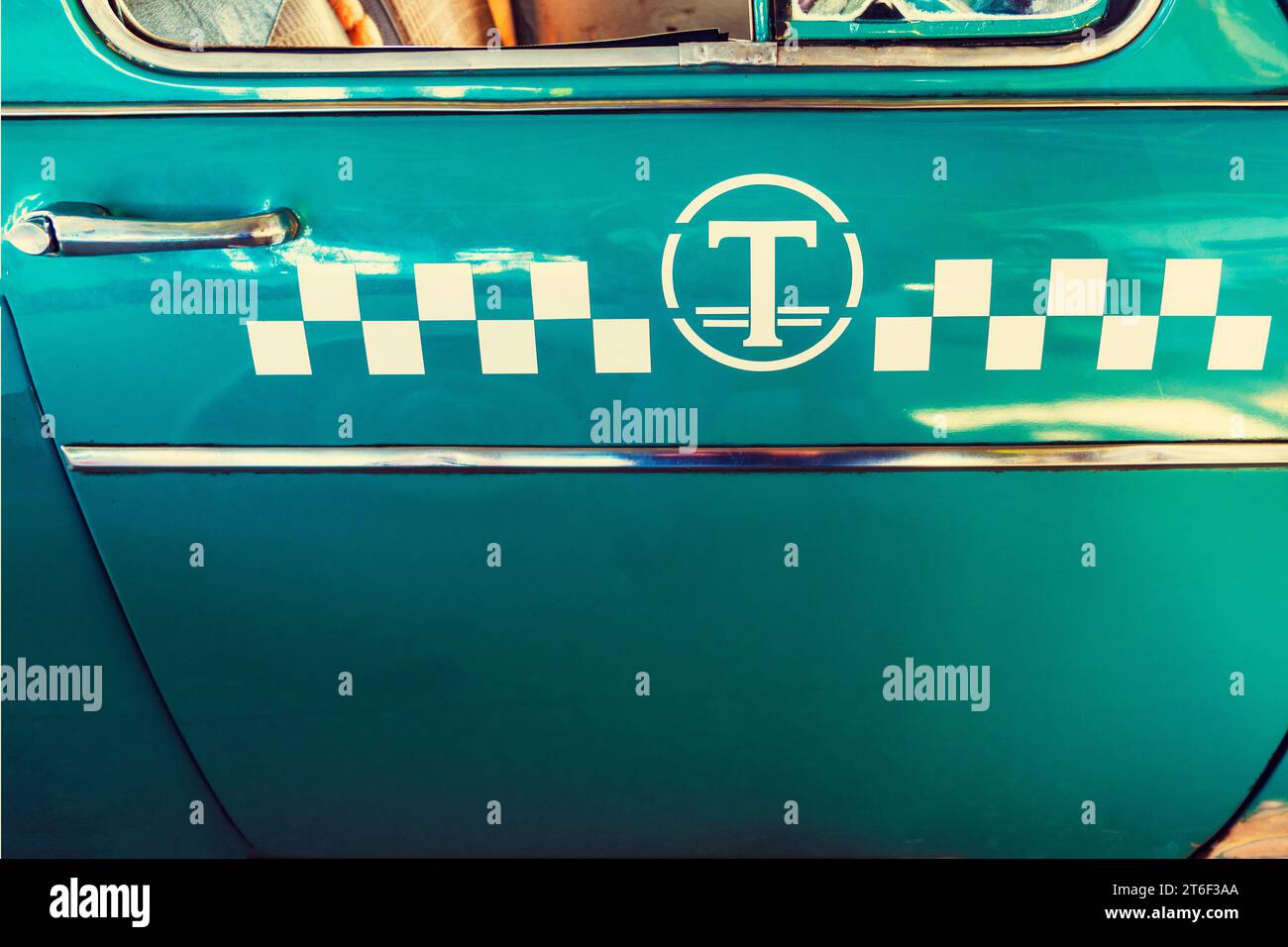 The sign of the retro taxi on a retro the car. Door of the old taxi ...