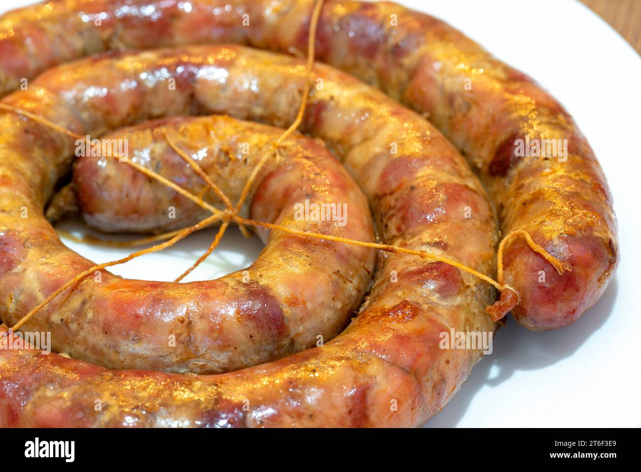 baked sausage. Homemade Pork sausage. Homemade sausage on the plate ...