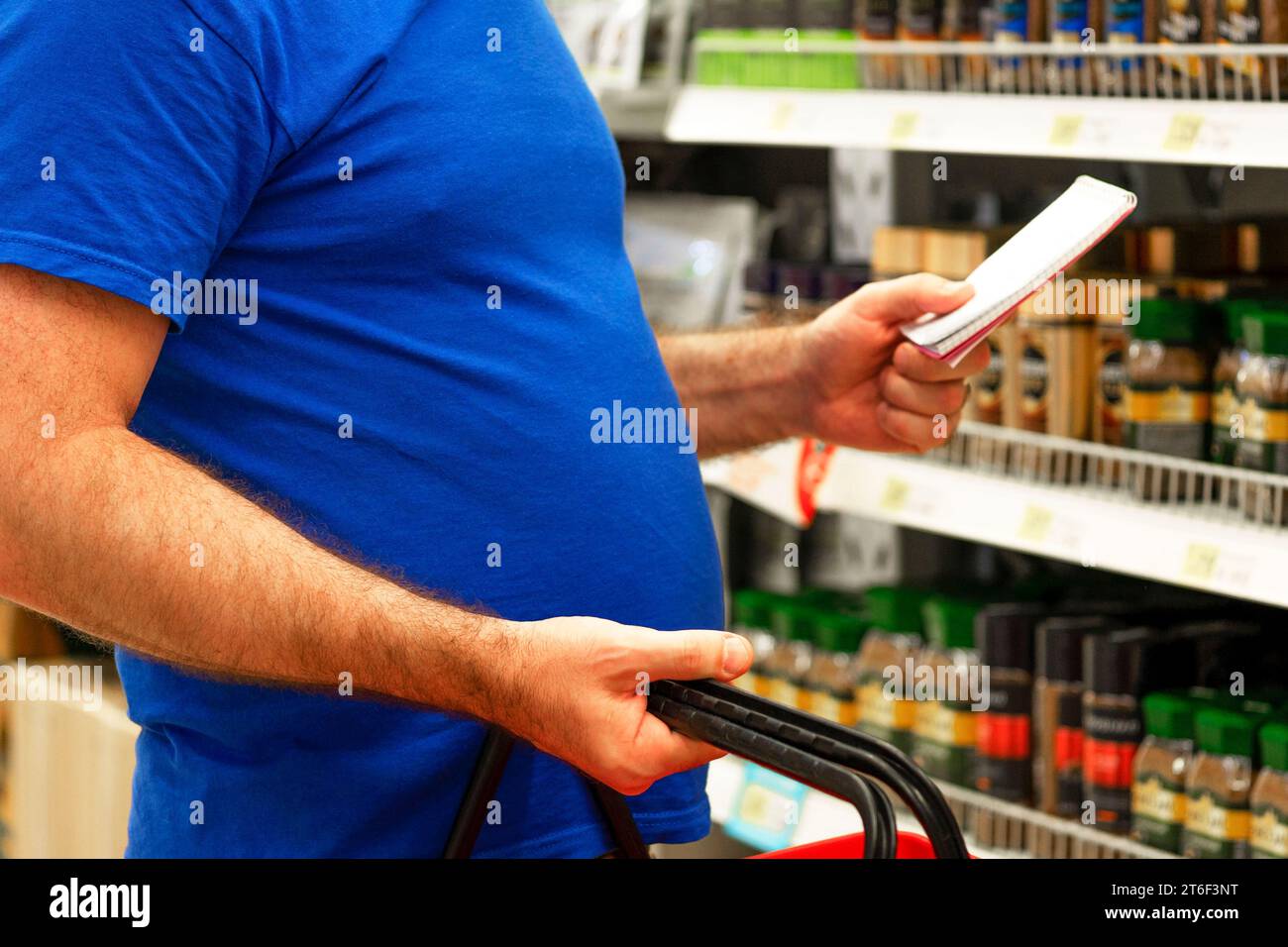 The the thoughtful man with the list of products in shopping mall. The ...