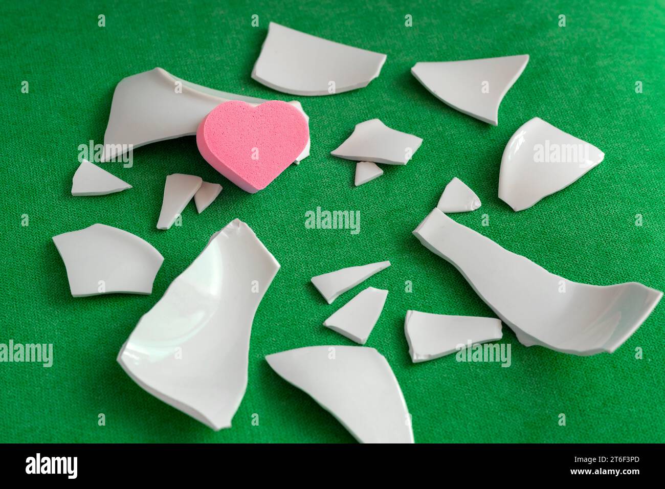 Heart among the fragments. Symbol of unhappy love. Bad health concept ...