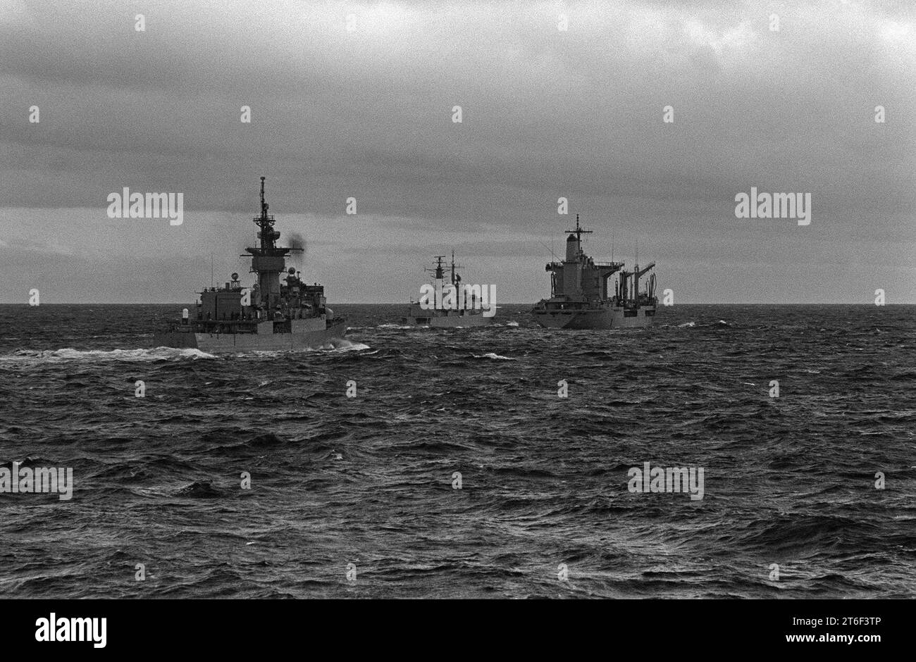 USS Pharris (FF-1094) approaching USS Merrimack (AO-179) and HMS ...