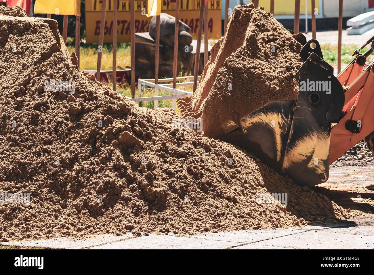 A bucket of the excavator with sand. Concept Road, construction works ... A bucket of the excavator with sand. Concept Road, construction works ...