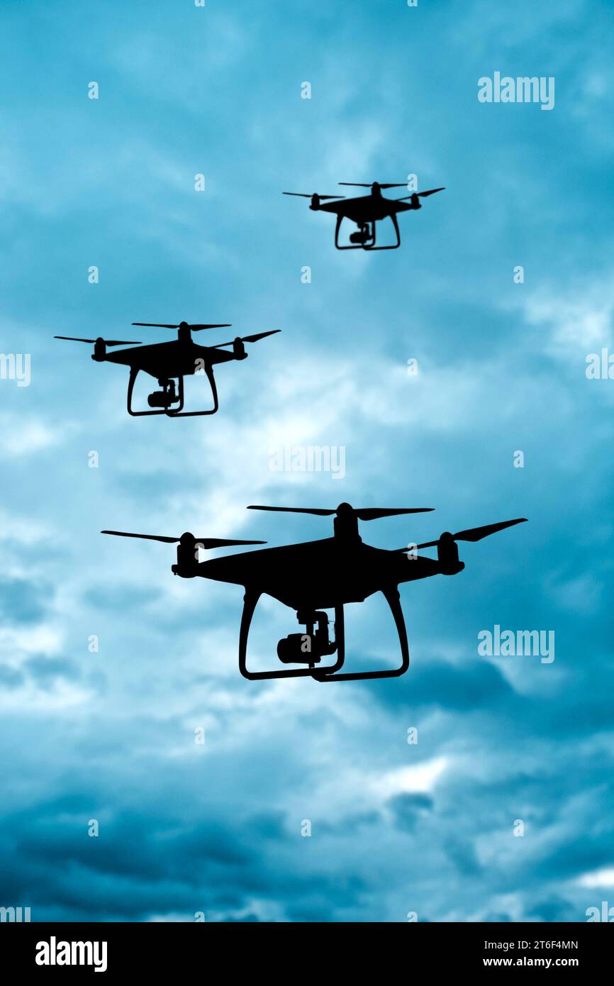 silhouette of drones in formation Stock Photo - Alamy