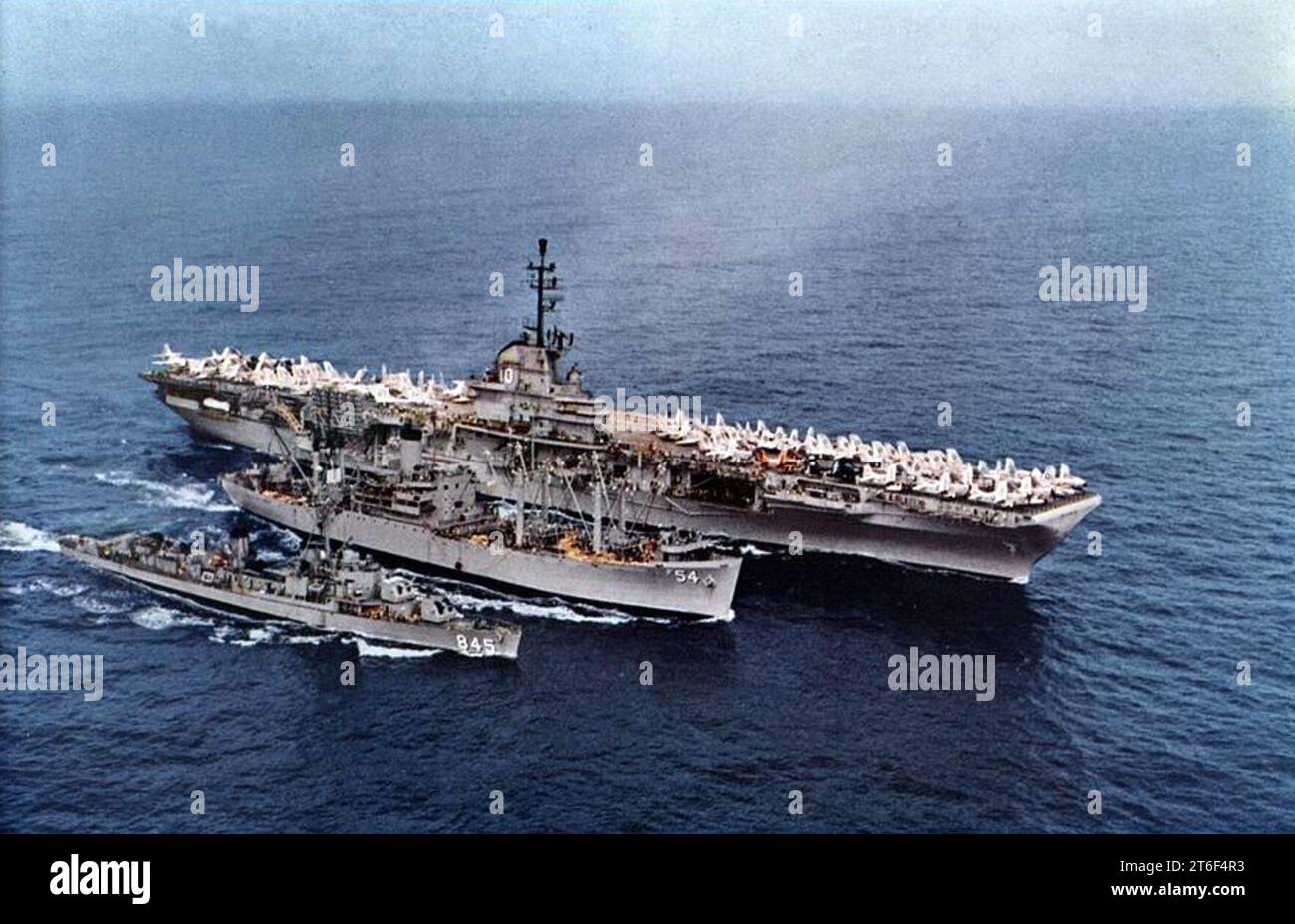 USS Pictor (AF-54) replenishing USS Yorktown (CVA-10) and USS Bausell ...