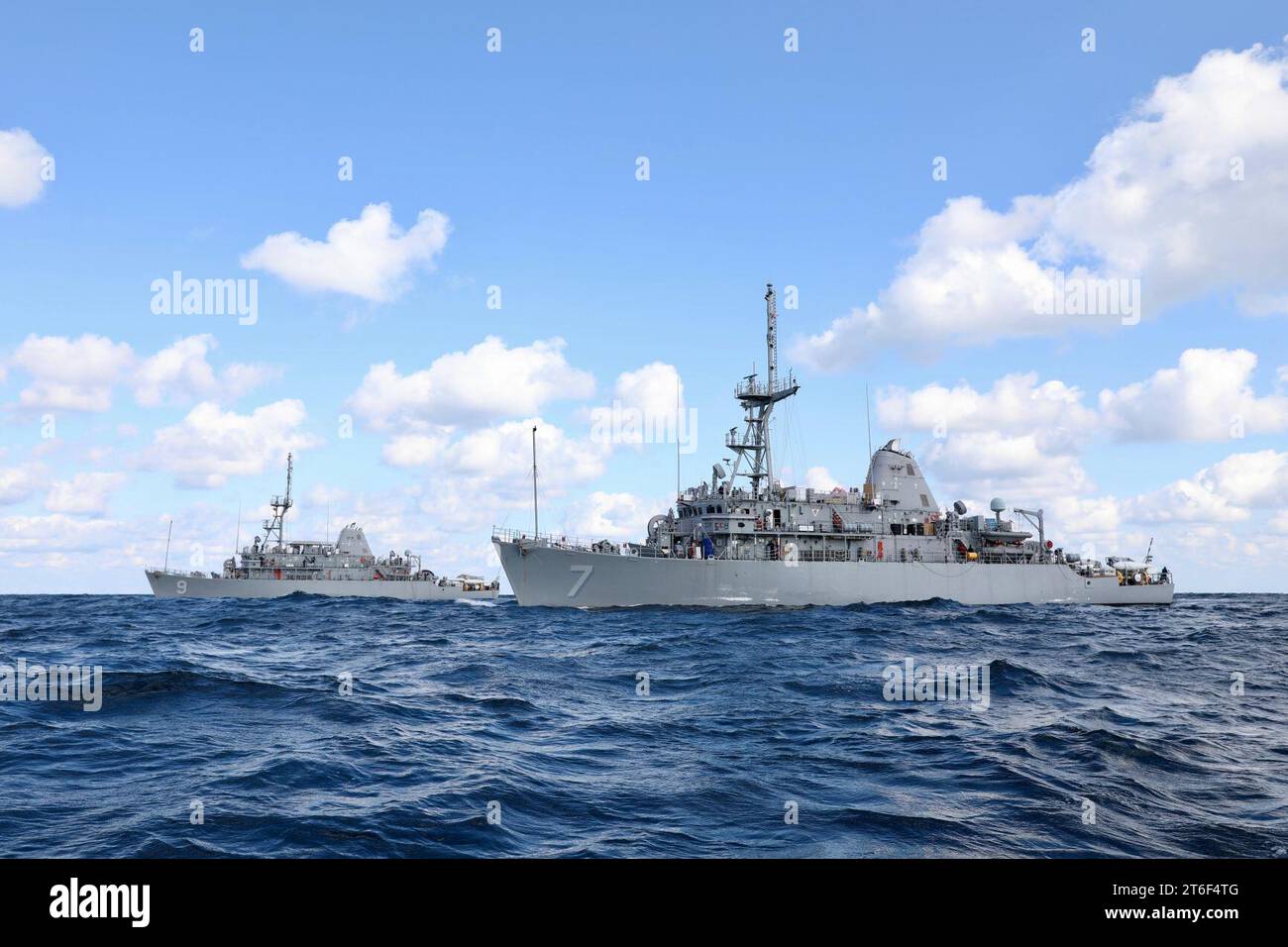 USS Pioneer (MCM-9) and USS Patriot (MCM-7) underway in the Sea of ...