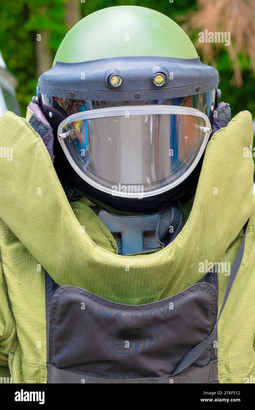 Armor costume consisting of a steel helmet. The concept of demining of ...