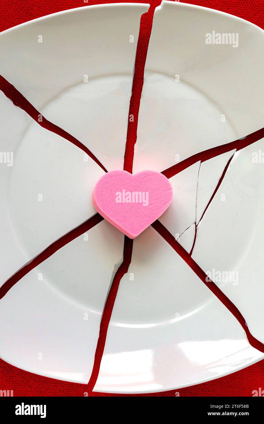 Heart among the fragments. Symbol of unhappy love. broken Heart concept ...