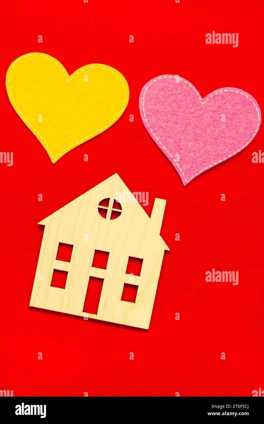 hearts and house. Symbol of love and home on a red background. Home ...