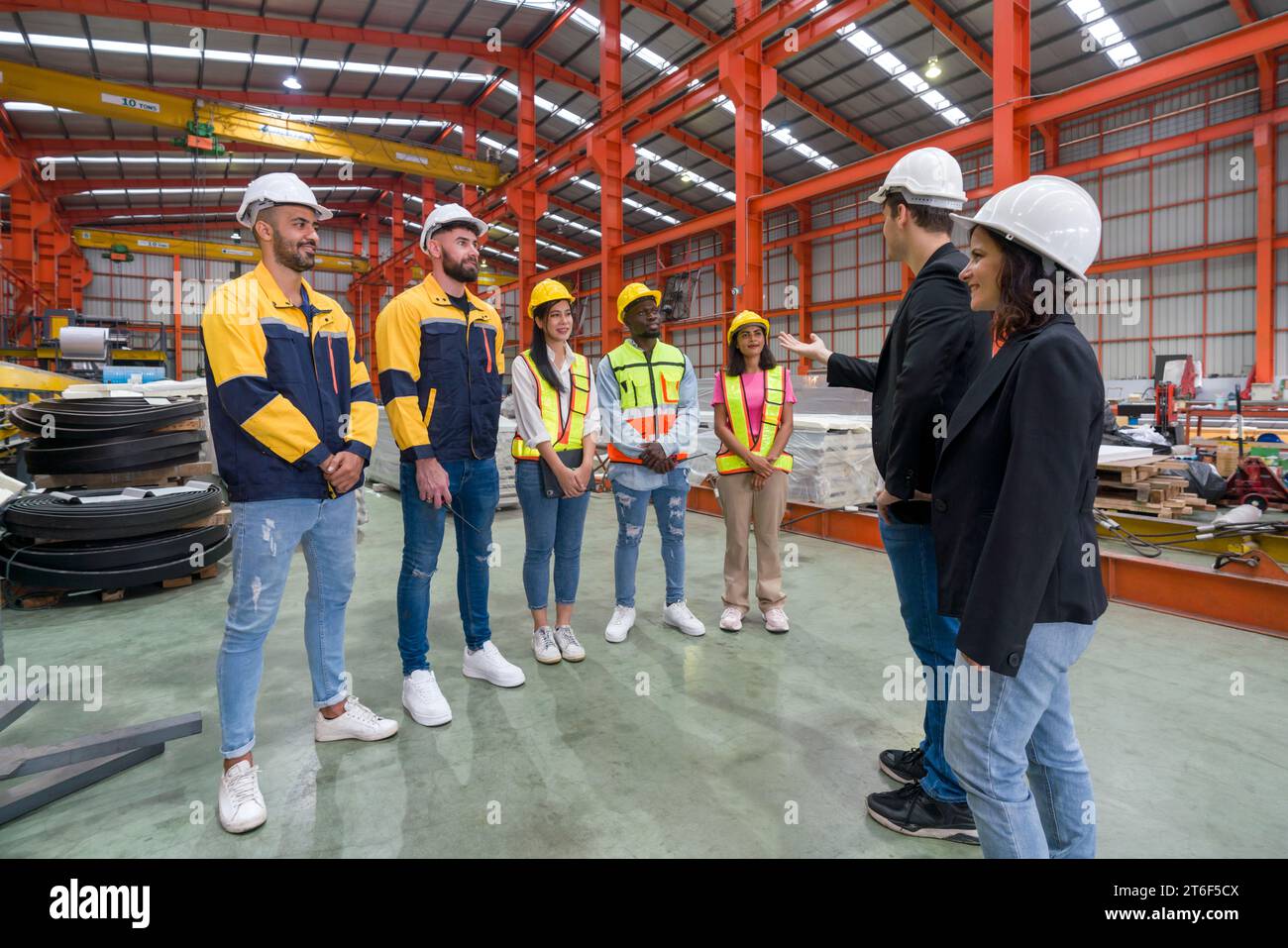 Warehouse safety meeting, people with hardhat. Industrial teamwork ...