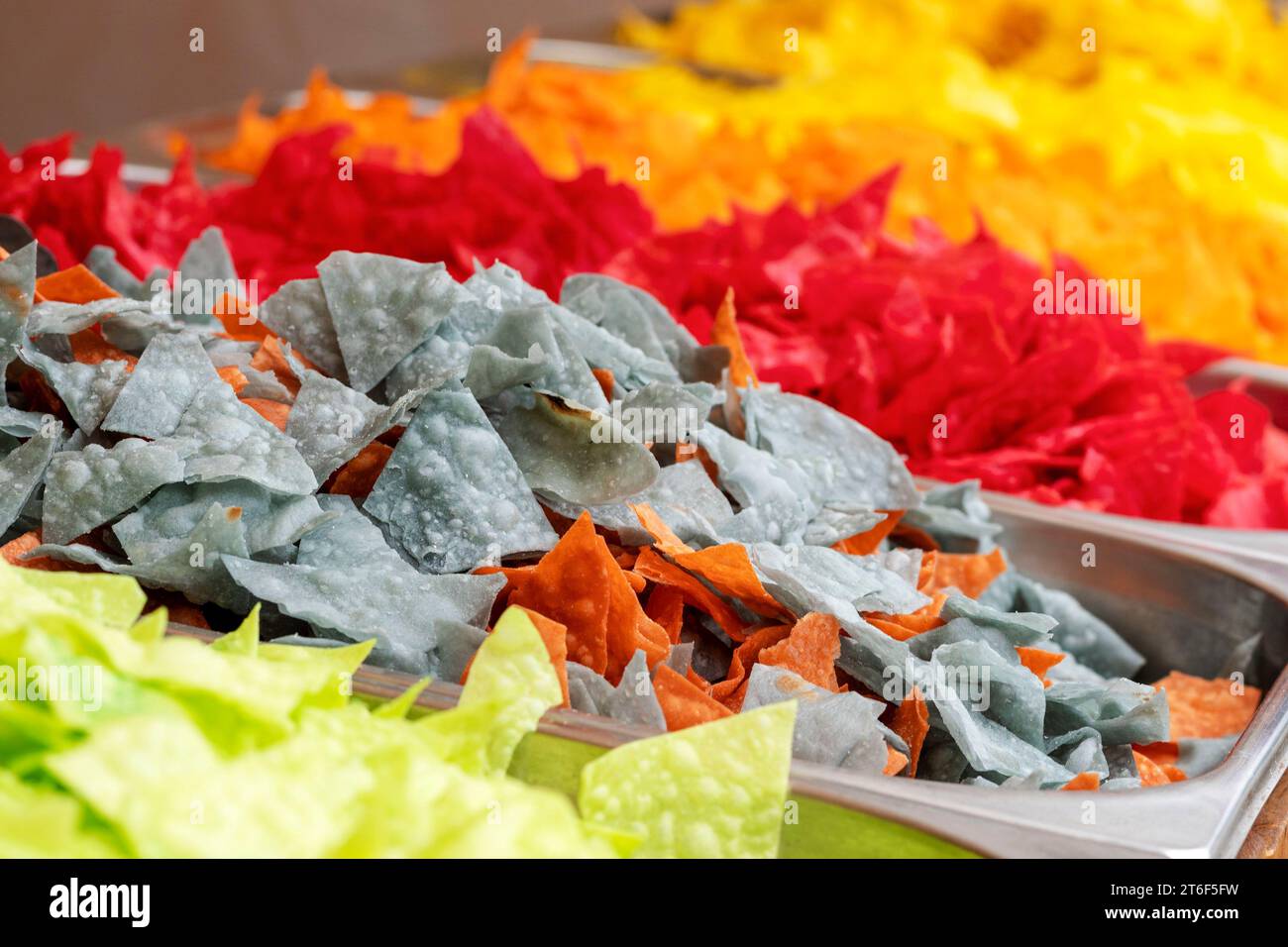 colored chips. Not natural colors of crackers. Not healthy food. close ...