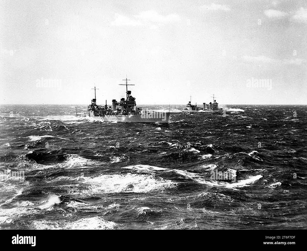 USS Quincy (CA-39) and USS Tuscaloosa (CA-37) in rough seas near the ...