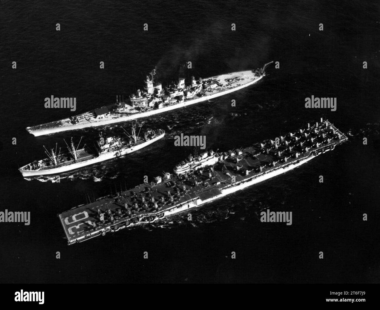 USS Rainier (AE-5) replenishing Antietam (CV-36) and Wisconsin (BB-64 ...