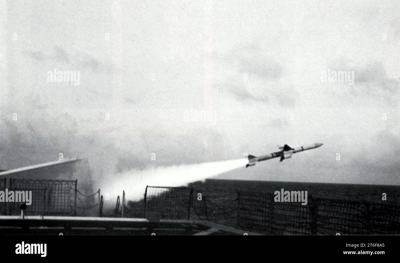 USS Reasoner (FF-1063) launches a RIM-7F Sea Sparrow missile, in 1978 ...