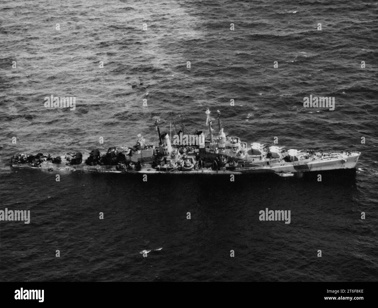 USS Reno (CL-96) under salvage after being torpedoed off the ...