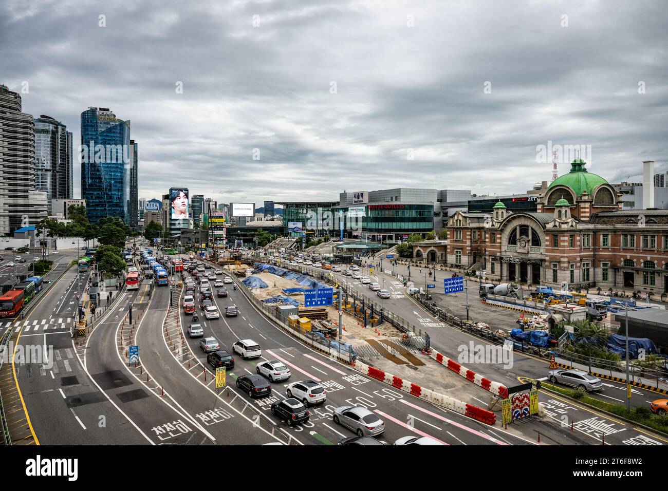 A bustling metropolitan cityscape featuring a busy intersection ...