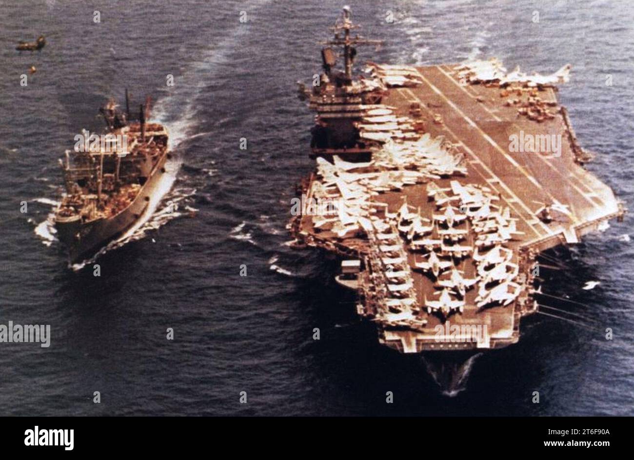 USS Rigel (AF-58) replenishes USS John F. Kennedy (CVA-67), in the ...