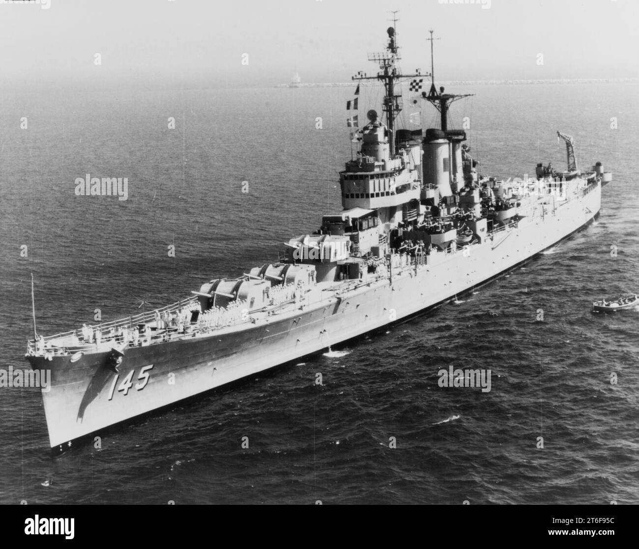 USS Roanoke (CL-145) underway at slow speed, circa the early 1950s ...