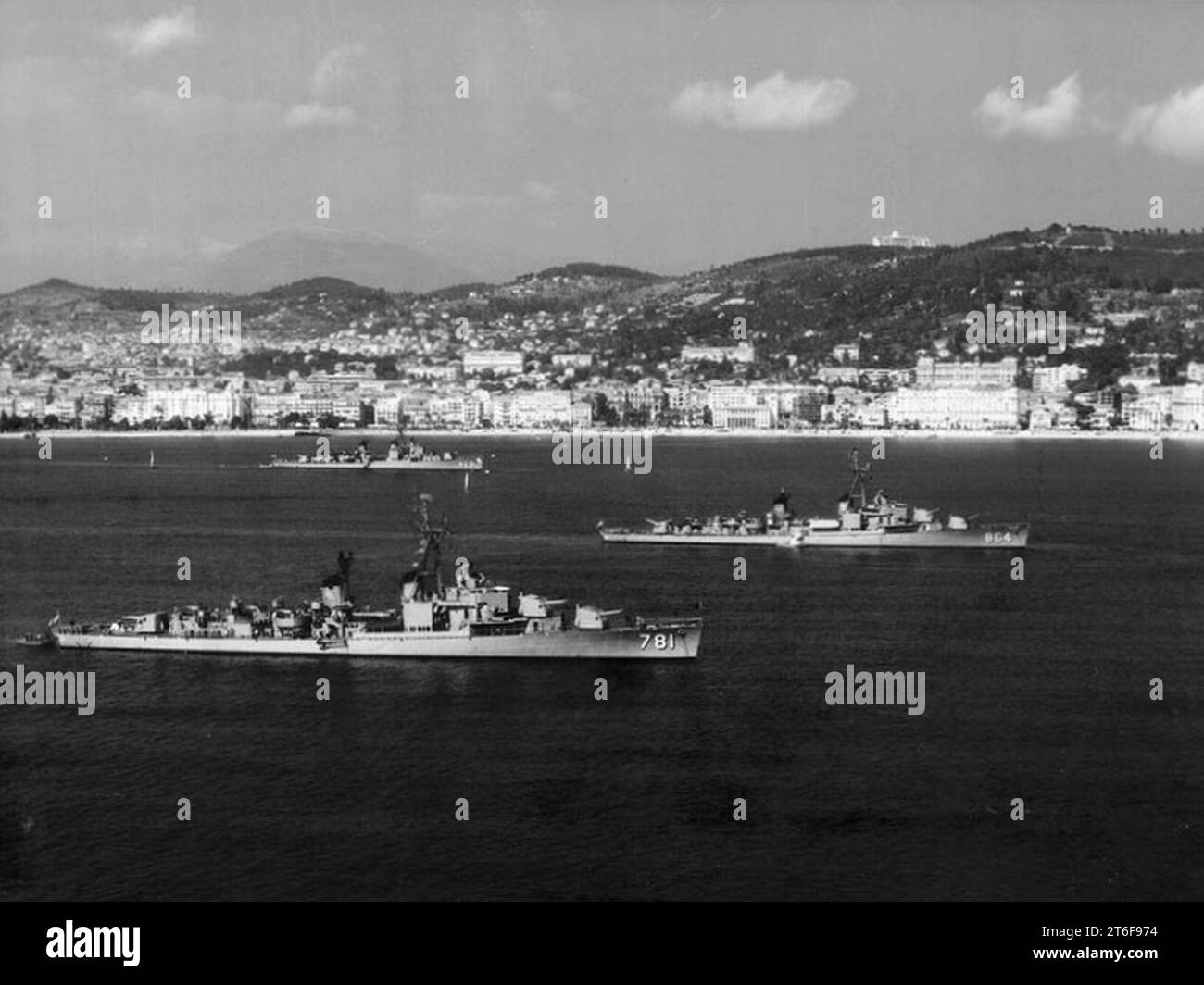 USS Robert K. Huntington (DD-781) at anchor with USS Harold J. Ellison ...