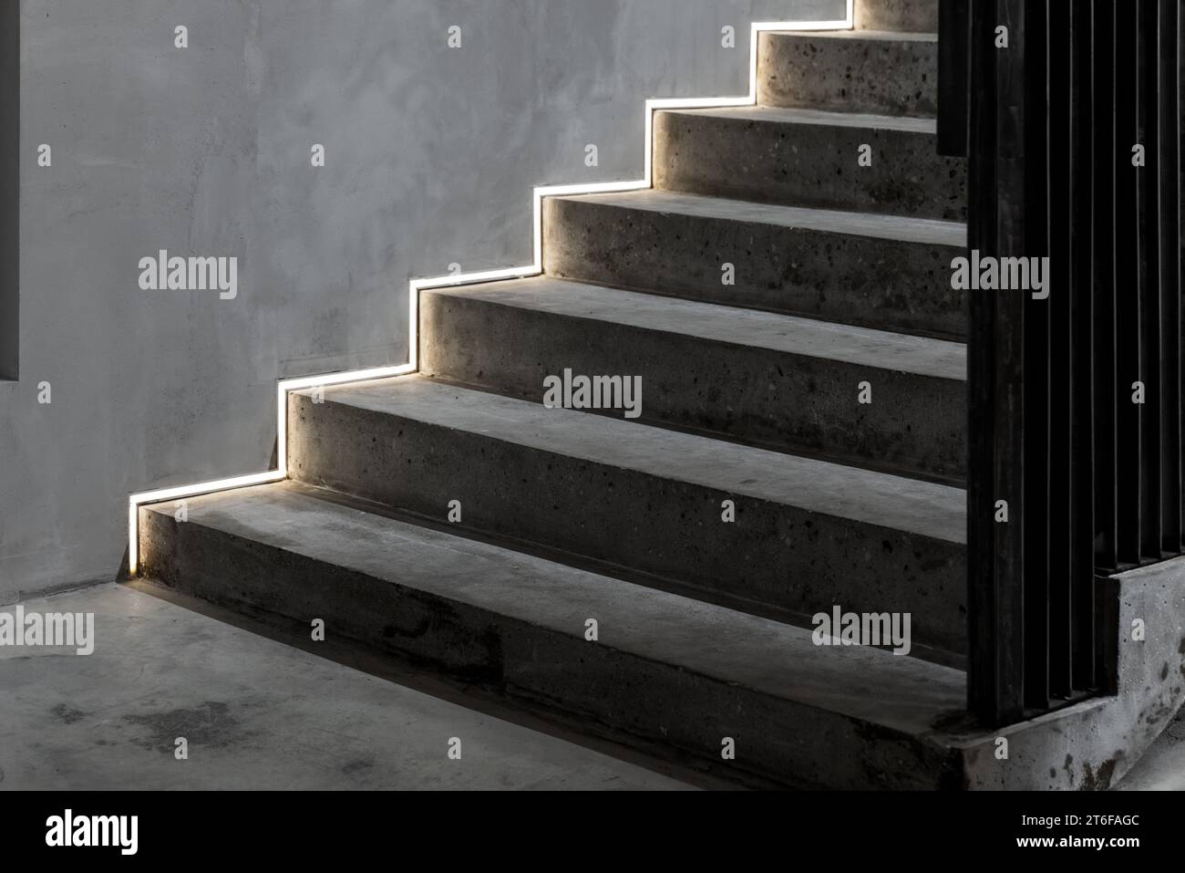 Concrete stairs with LED light lines illumination, abstract dark ...