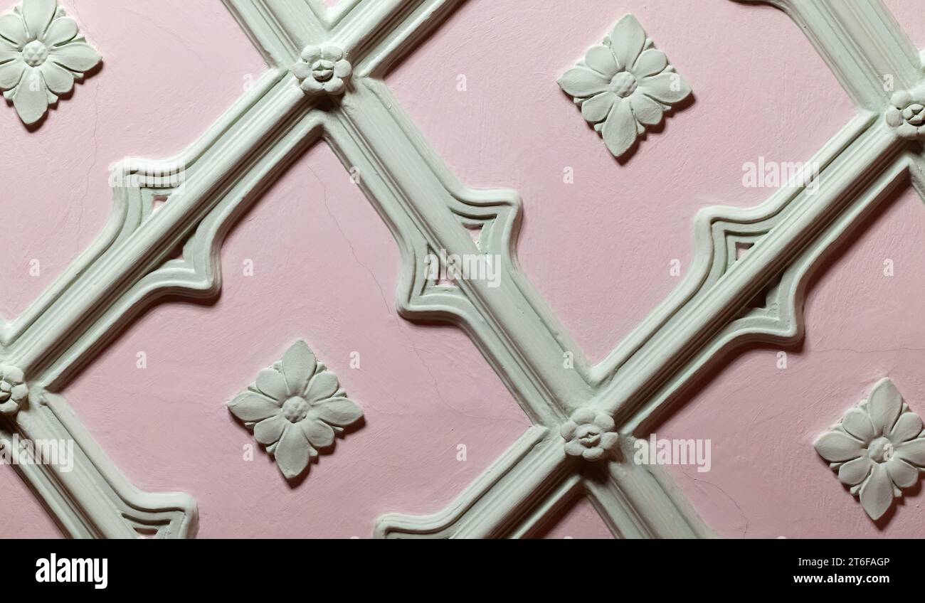 Ceiling design elements. Light green gypsum bas-relief pattern over ...