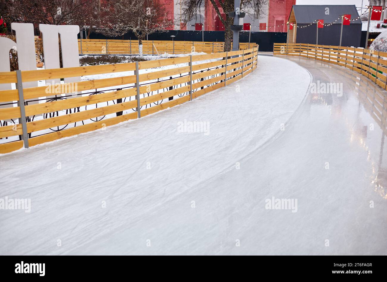 Outdoor skating rink, icy surface. Skating in winter city rink Stock ...