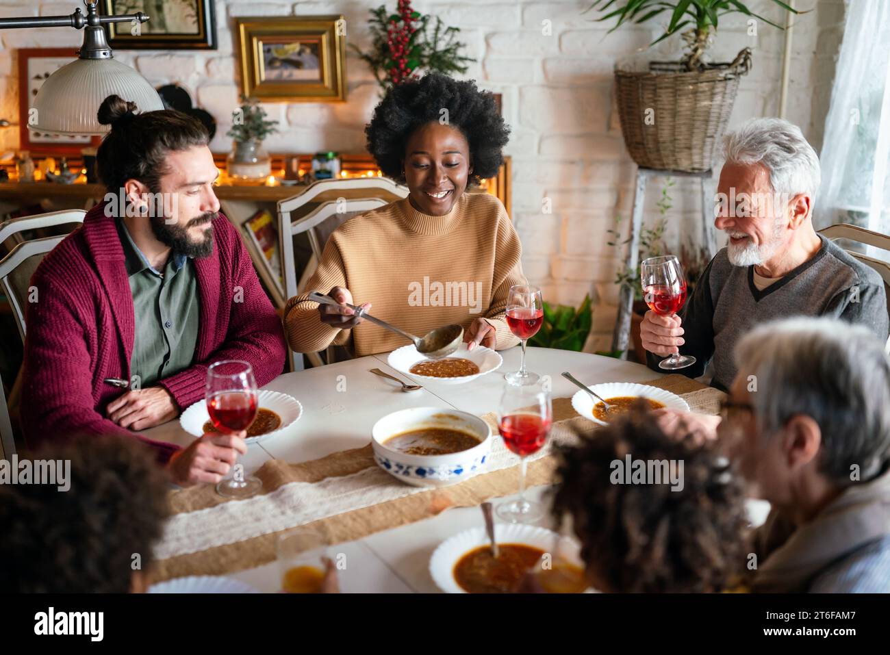 Happy multiethnic multigeneration family having fun together around ...