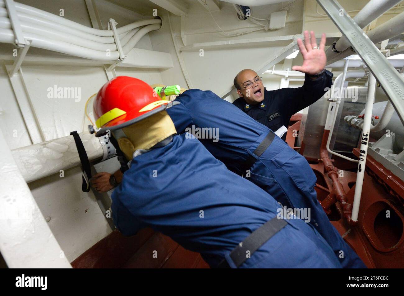 USS Ross damage control drill 140801 Stock Photo - Alamy