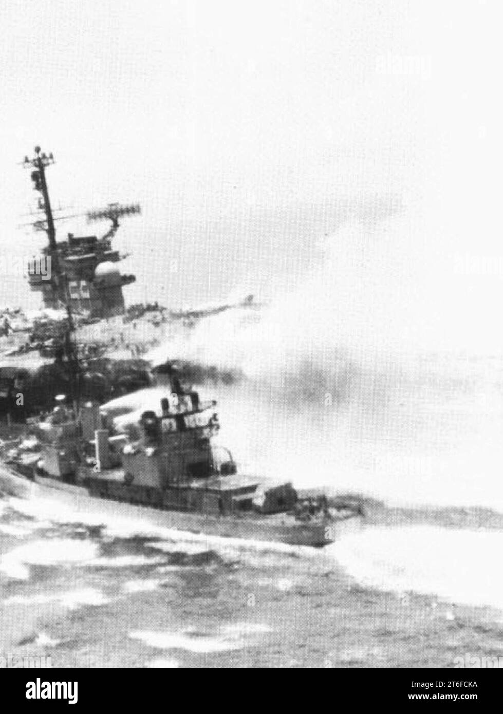 USS Rupertus (DD-851) fighting fires on USS Forrestal (CVA-59) in 1967 ...