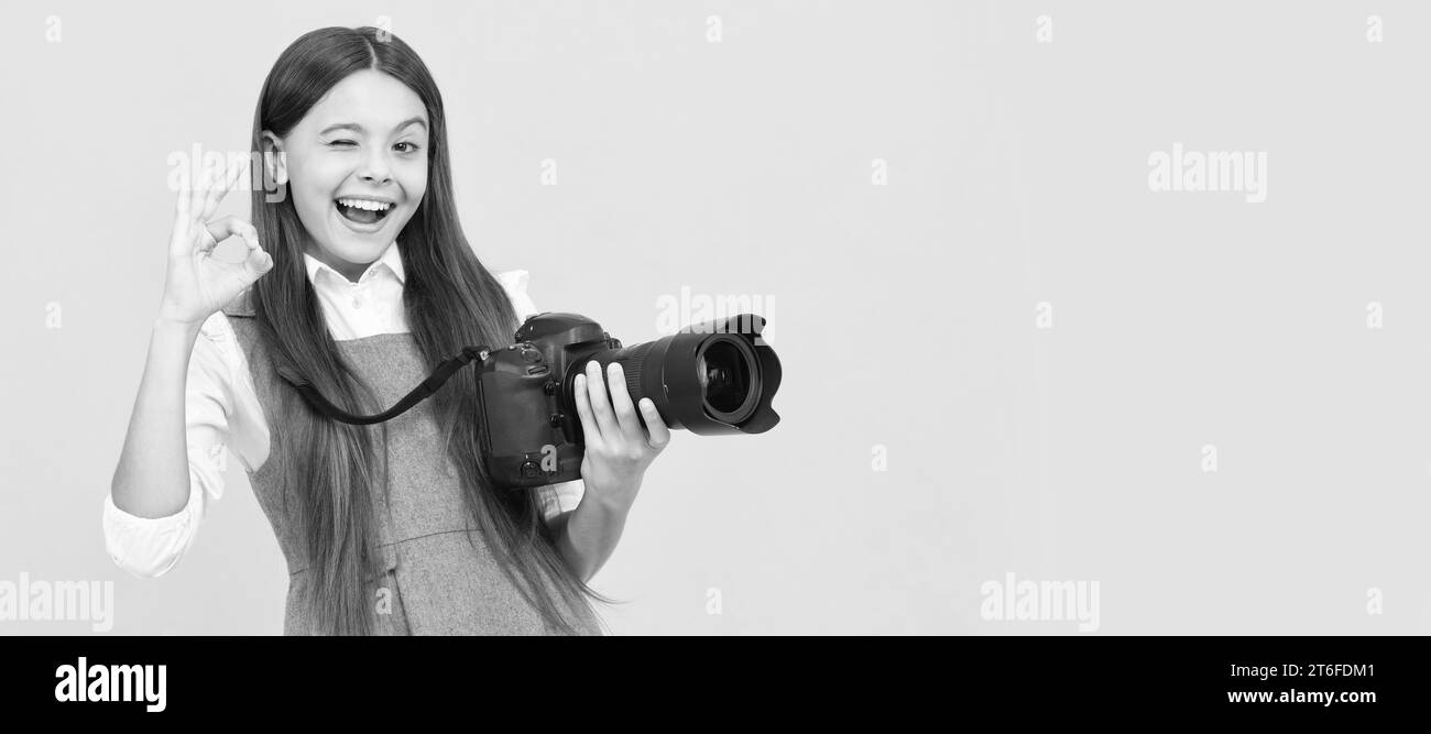 cheerful kid girl take photo with digicam show ok gesture, photography ...