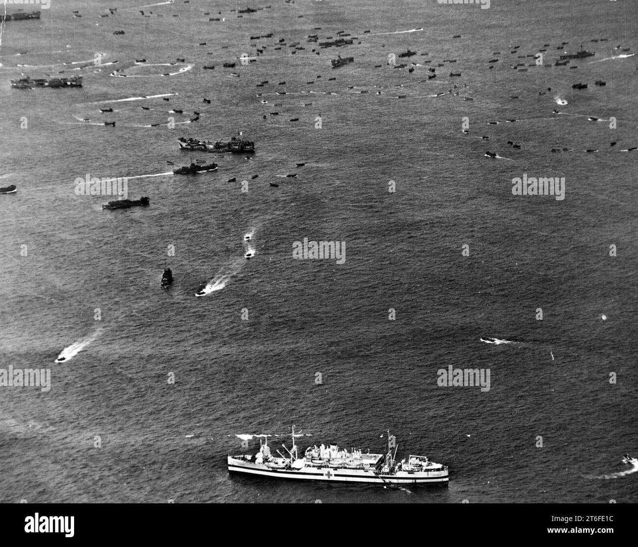 USS Samaritan (AH-10) and landing craft off Iwo Jima, 20 February 1945 ...