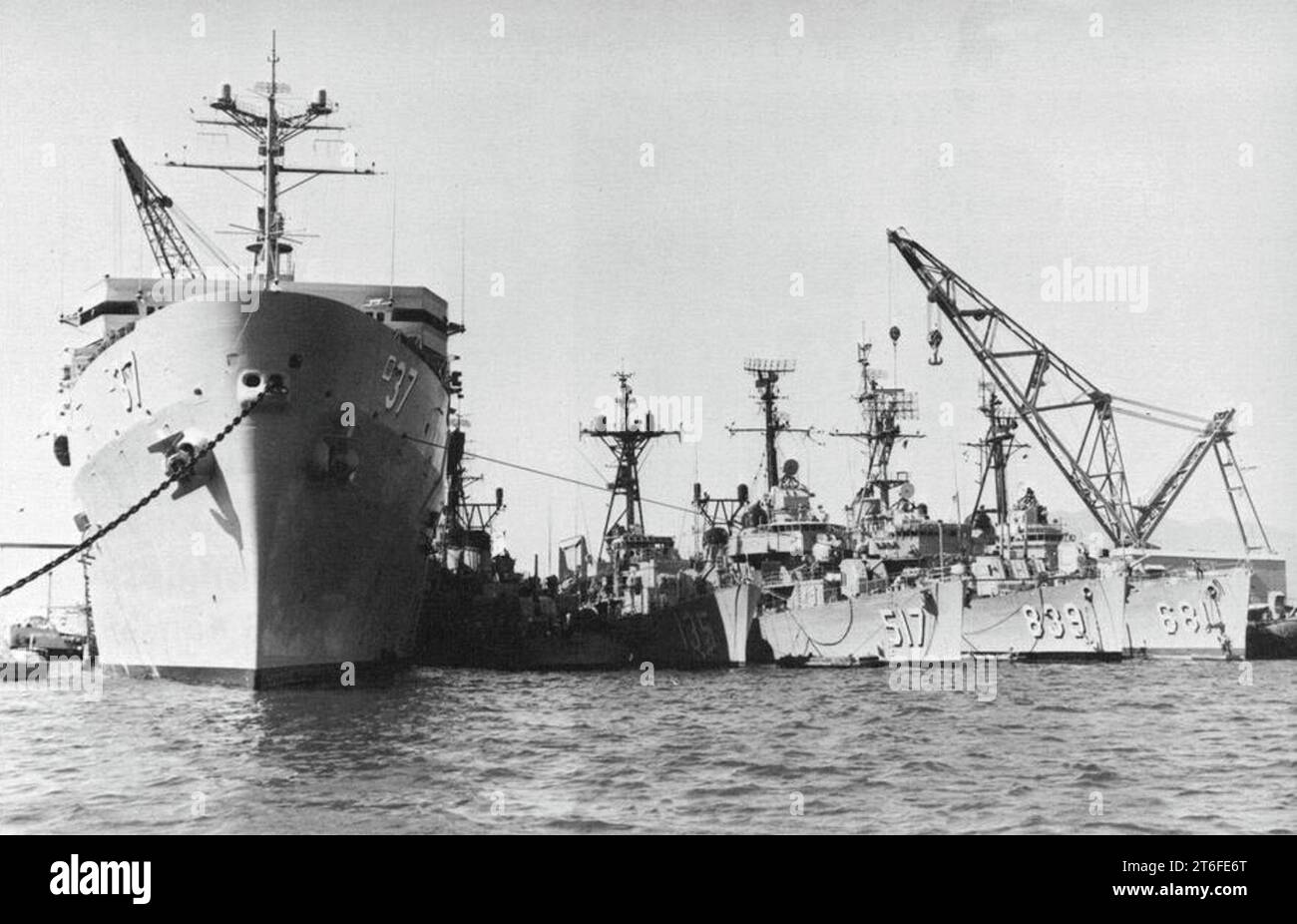USS Samuel Gompers (AD-37) in port with destroyers alongside, circa in ...