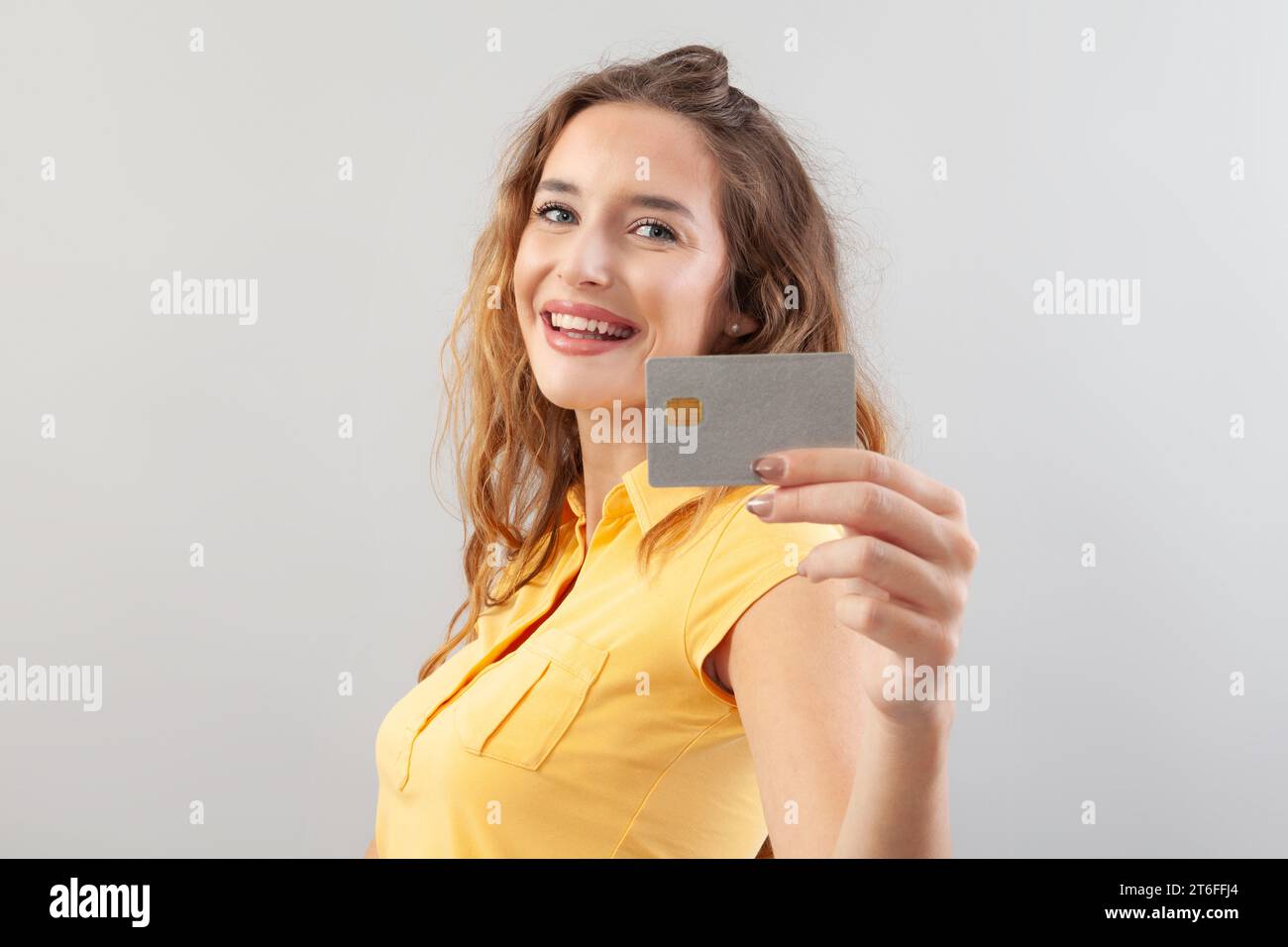 Portrait of laughing girlish woman with long hair do wear yellow top ...
