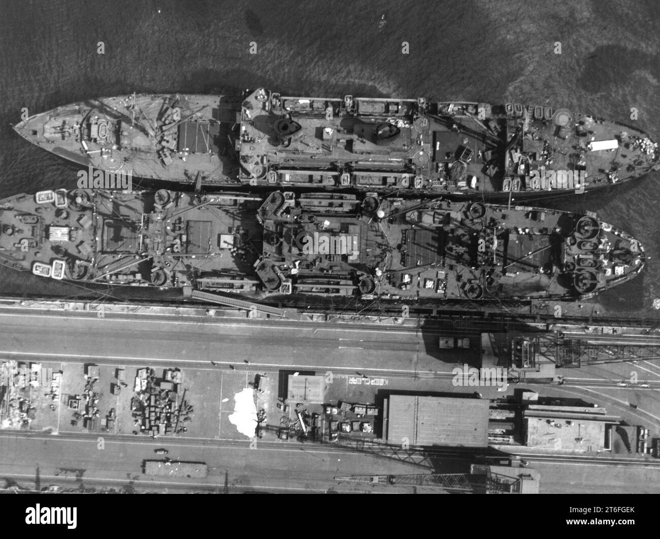 USS San Saba (APA-232) and USS Audrain (APA-59) in port, circa in 1945 ...
