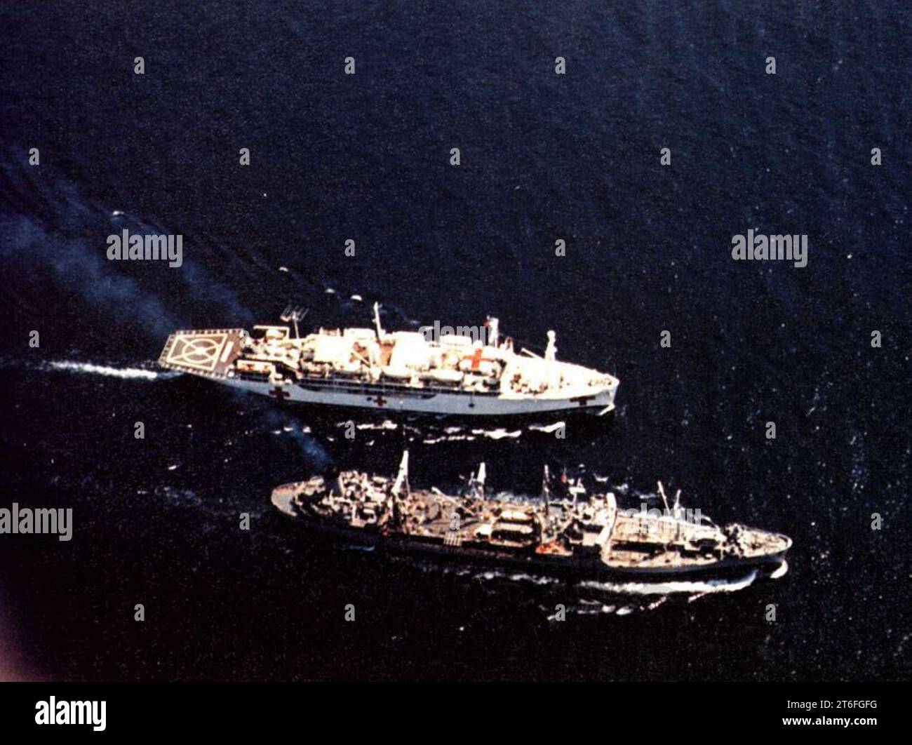 USS Sanctuary (AH-17) approaches a fleet oiler in the South China Sea ...