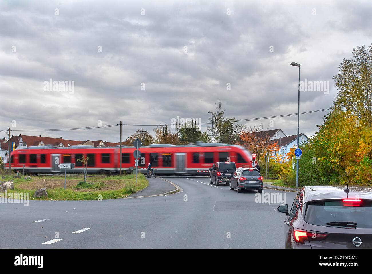 Suburban railway crossing a restricted level crossing, Eckental, Middle ...