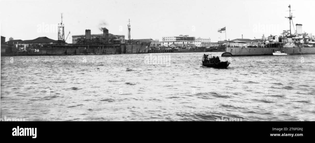 USS Sappho (AKA-38) and a Dido-class cruiser at Shanghai, China, in ...