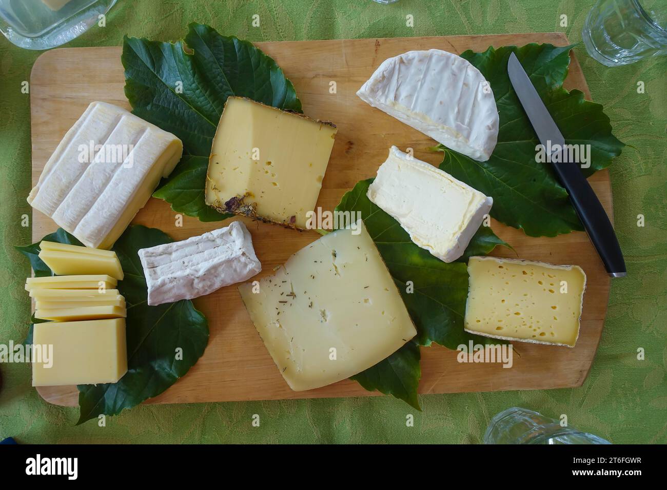 Cheese platter, various cheeses on wooden board, hard cheese, camembert ...