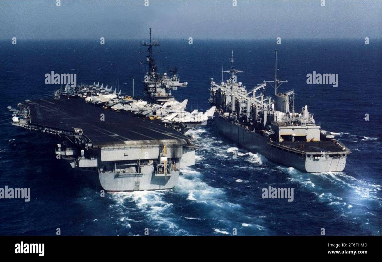 USS Seattle (AOE-3) alongside USS Saratoga (CV-60) following an ...