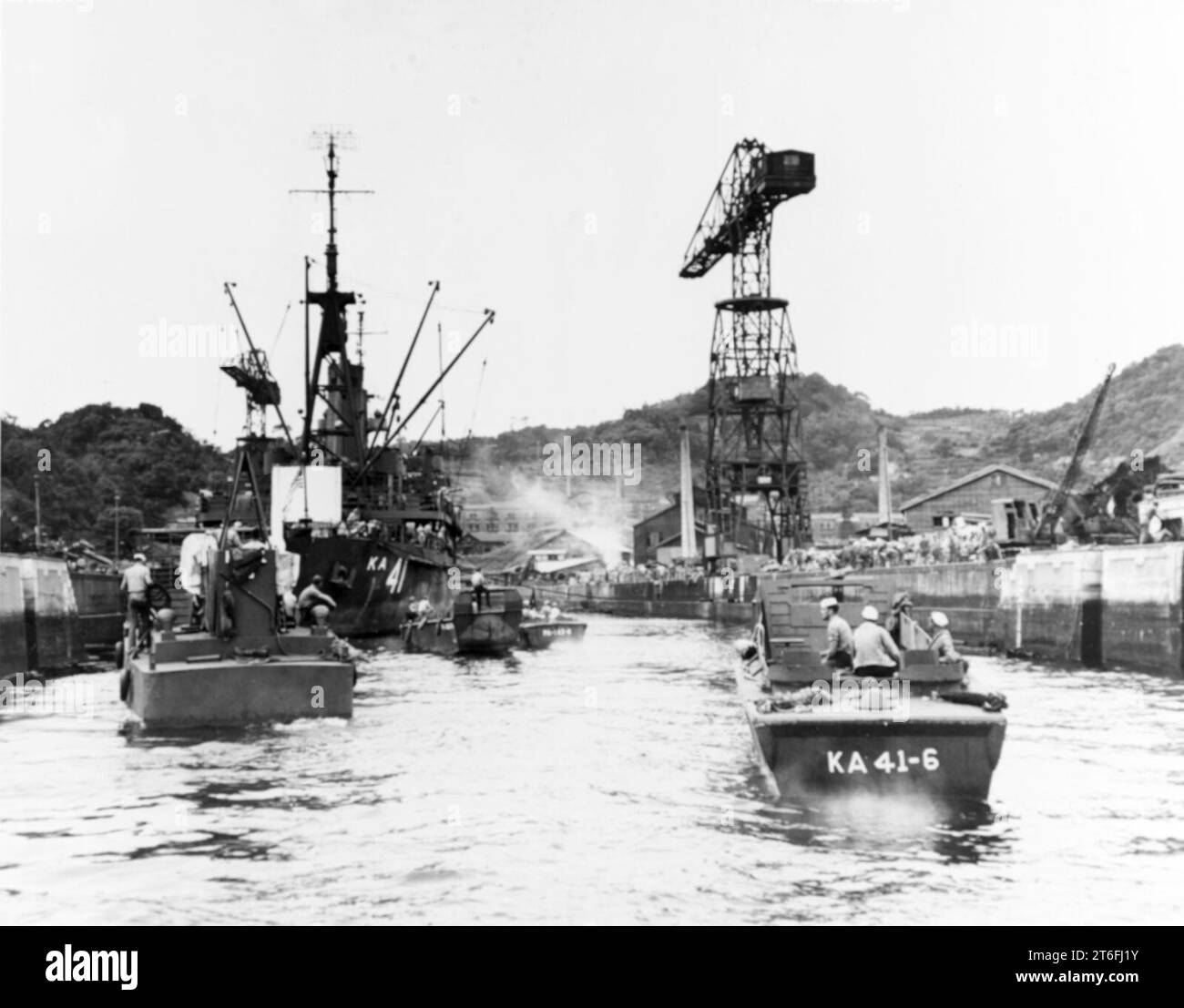 USS Selinur (AKA-41) mooring at Sasebo Naval Base, Japan, 24 September ...